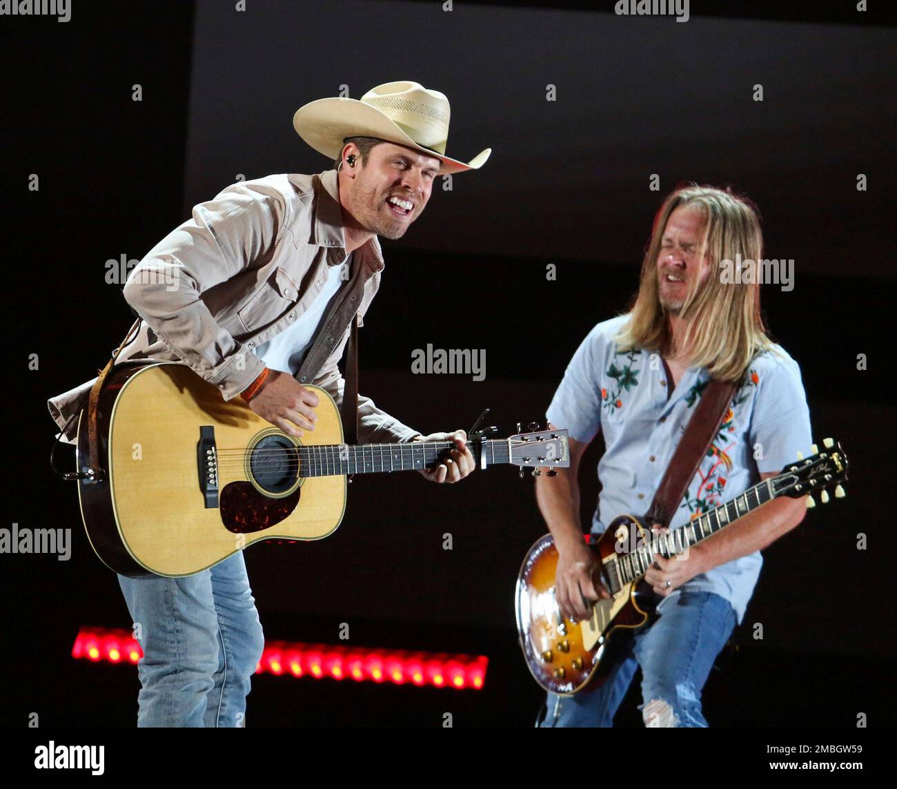 Dustin Lynch, left, performs at the iHeartCountry Festival on Saturday ...