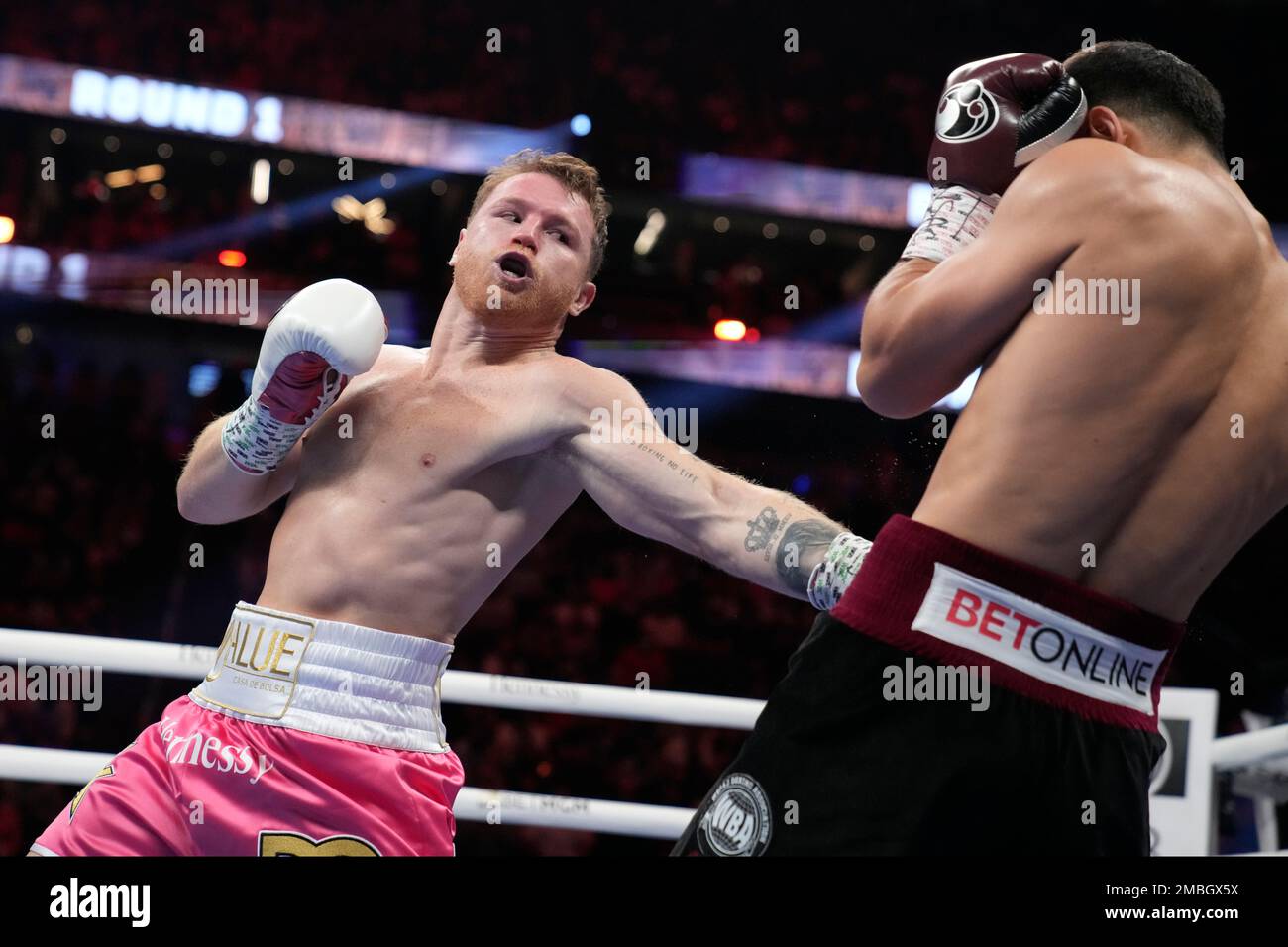 Canelo Alvarez, left, of Mexico, throws a punch against Dmitry Bivol ...