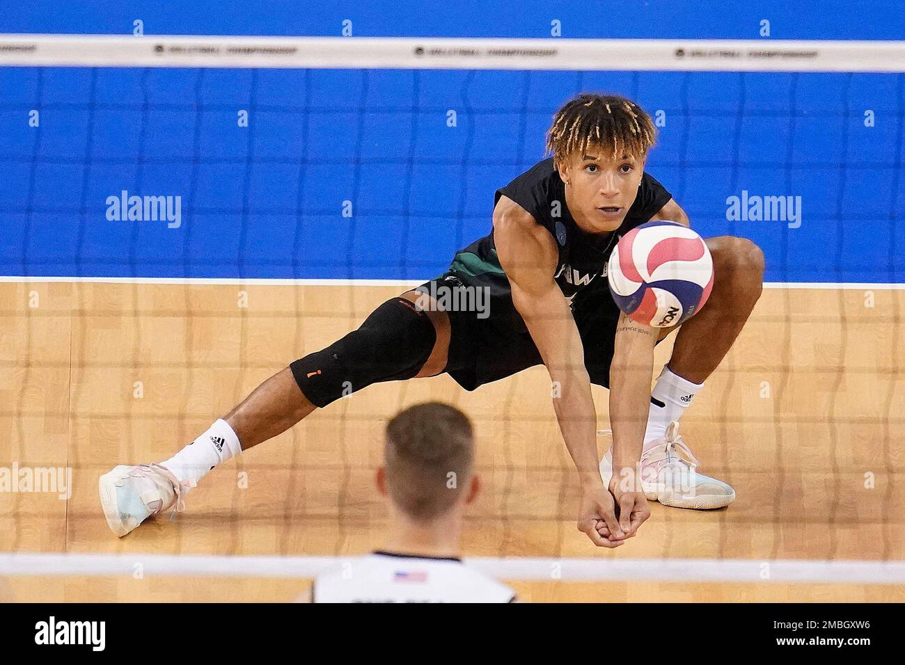 Hawaii outside hitter Chaz Galloway digs a serve from Long Beach State ...