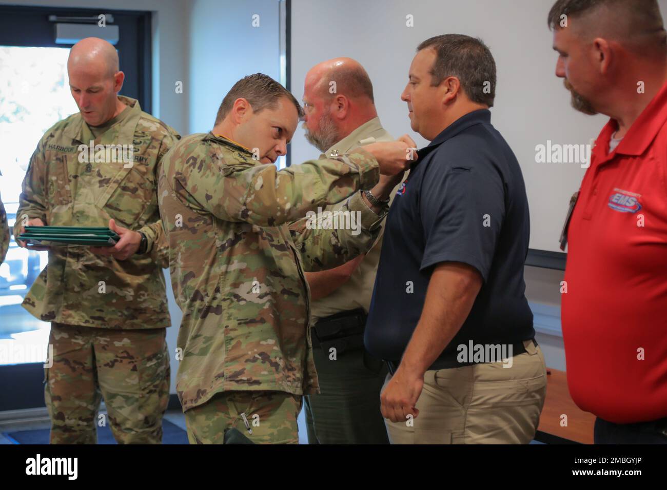 Col. Vincent Myers, the BACH Commander, and Col. Andrew Jordan, the ...