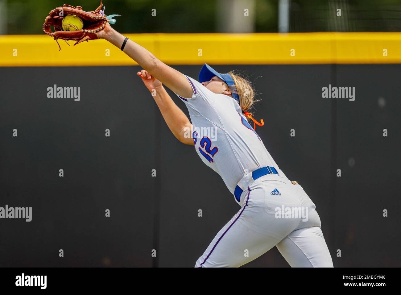Presbyterian outfielder Rebecca Clark stretches to make a catch against ...