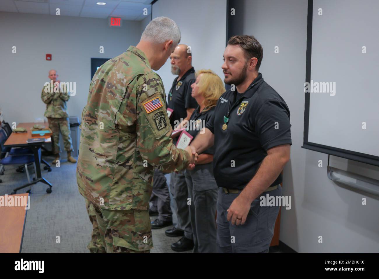 Col. Vincent Myers, the BACH Commander, and Col. Andrew Jordan, the ...