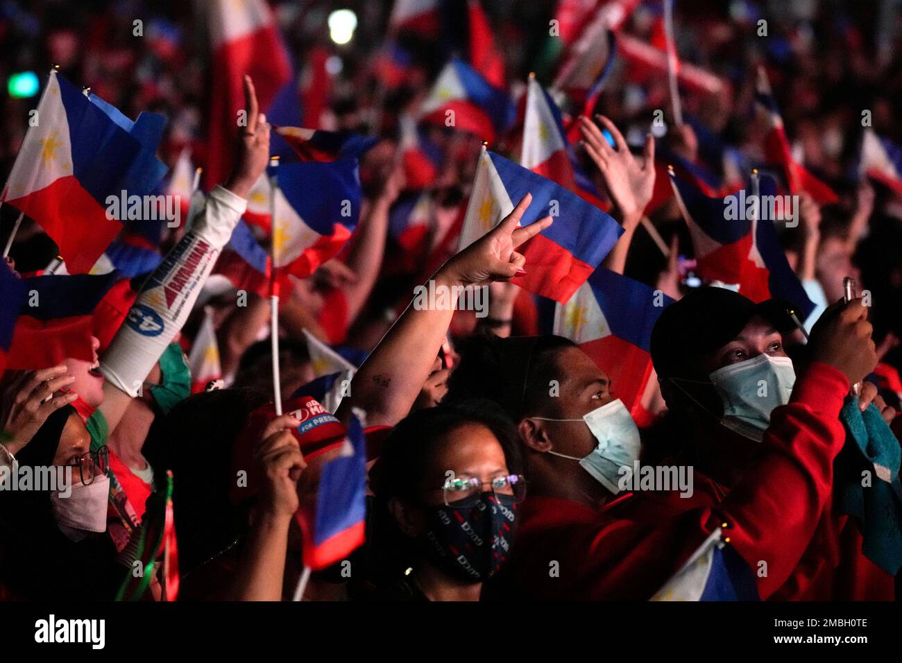 Supporters gesture while listening to presidential candidate, Ferdinand ...