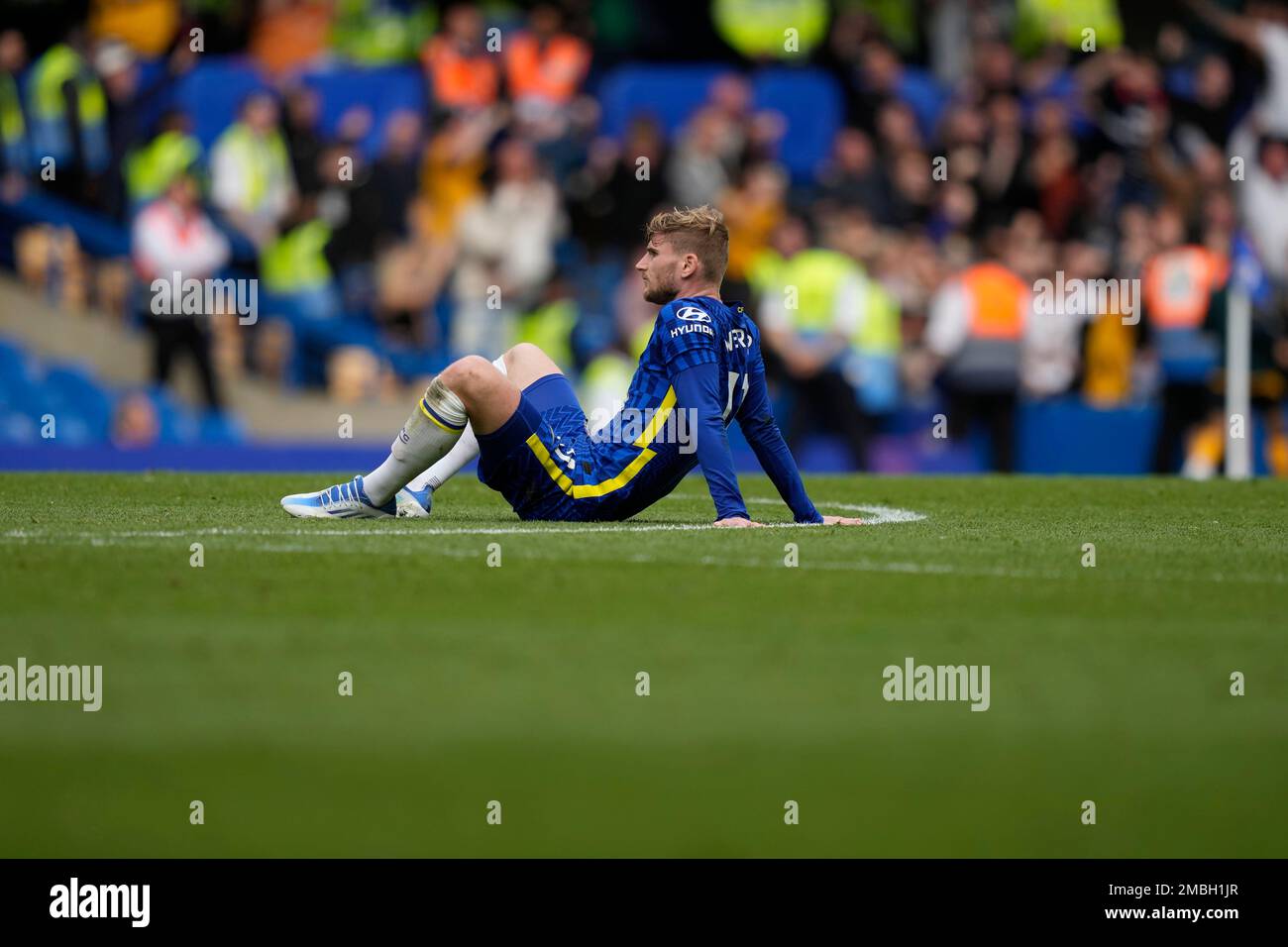 Chelsea's Timo Werner sits on the field at the end of the English ...