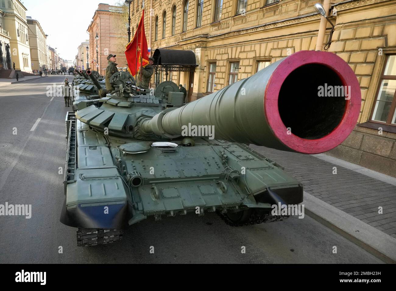 Russian soldiers install a Red banner on their T-72 tank prior to a ...