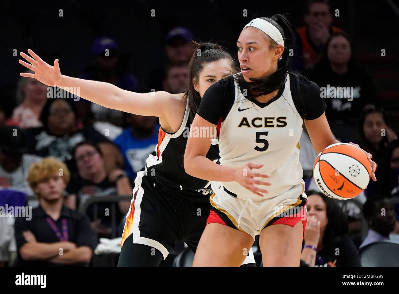 Las Vegas Aces' Dearica Hamby (5) looks for a way to get around Phoenix ...