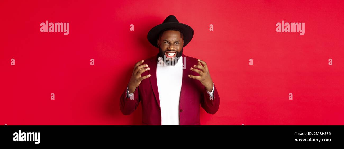 Angry african american man looking aggressive, shaking hands and ...