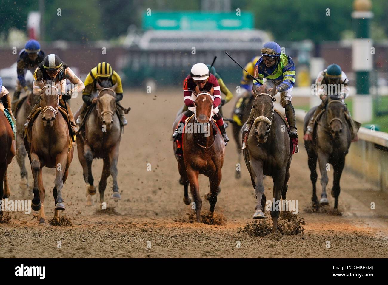 Luis Saez rides Secret Oath, second from right, across the finish line ...