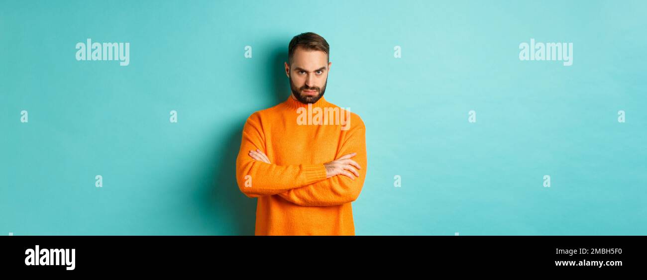 Offended man looking angry at you, cross arms on chest and stare mad ...