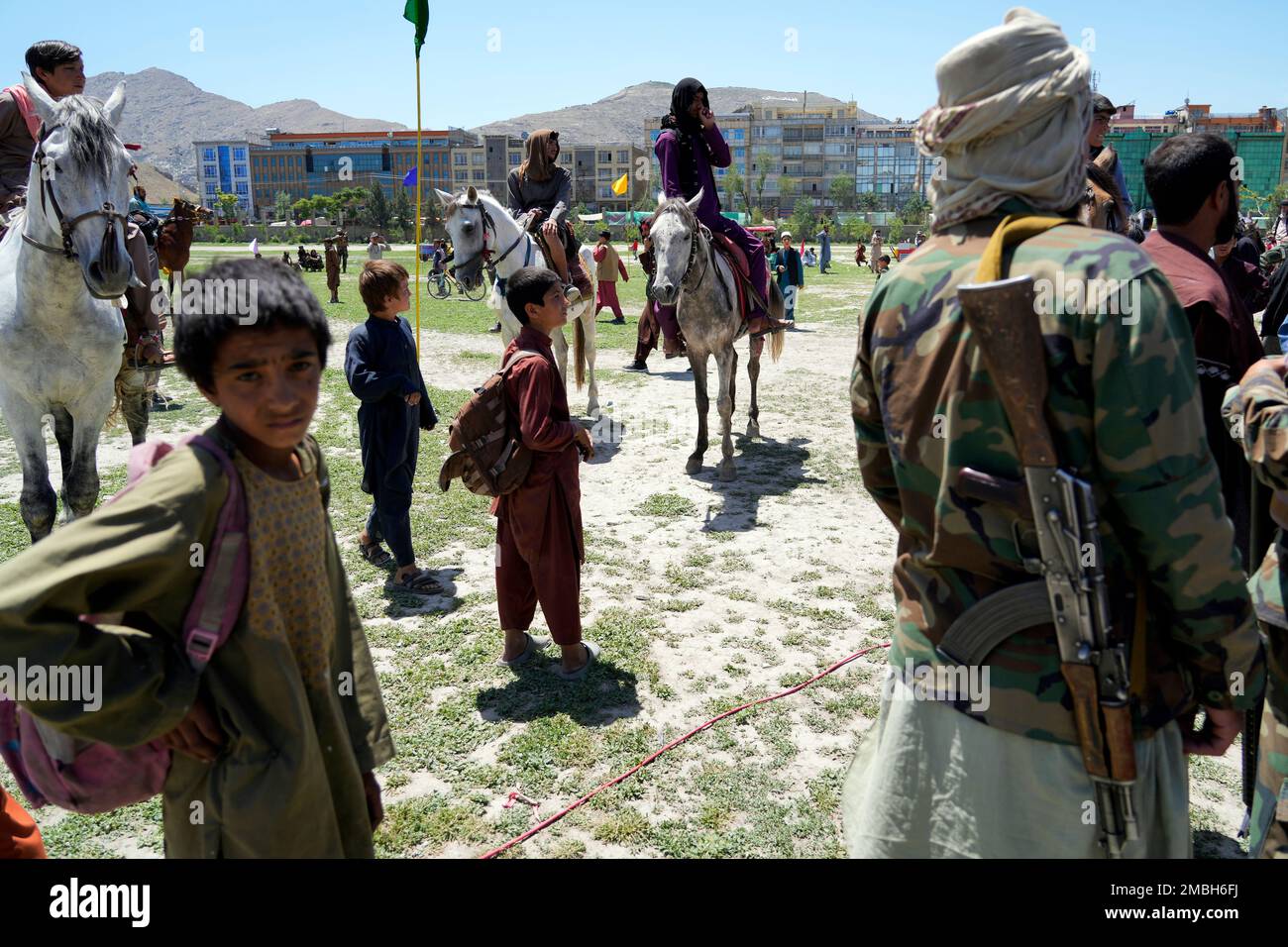 Afghan people attend a spear racing with horse as a Taliban fighter ...