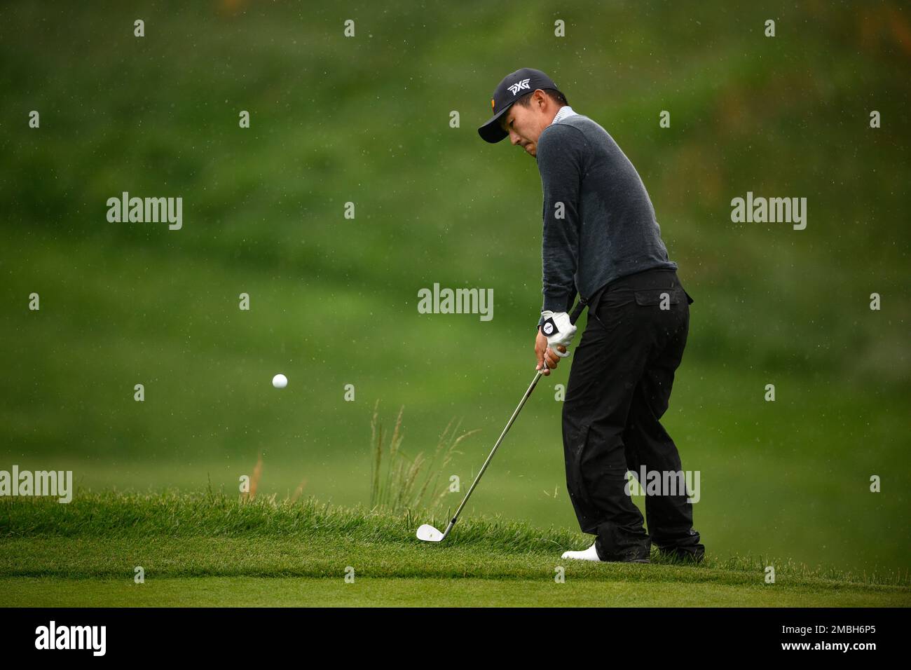 Sung Kang, of South Korea, hits onto the 18th green during the second ...