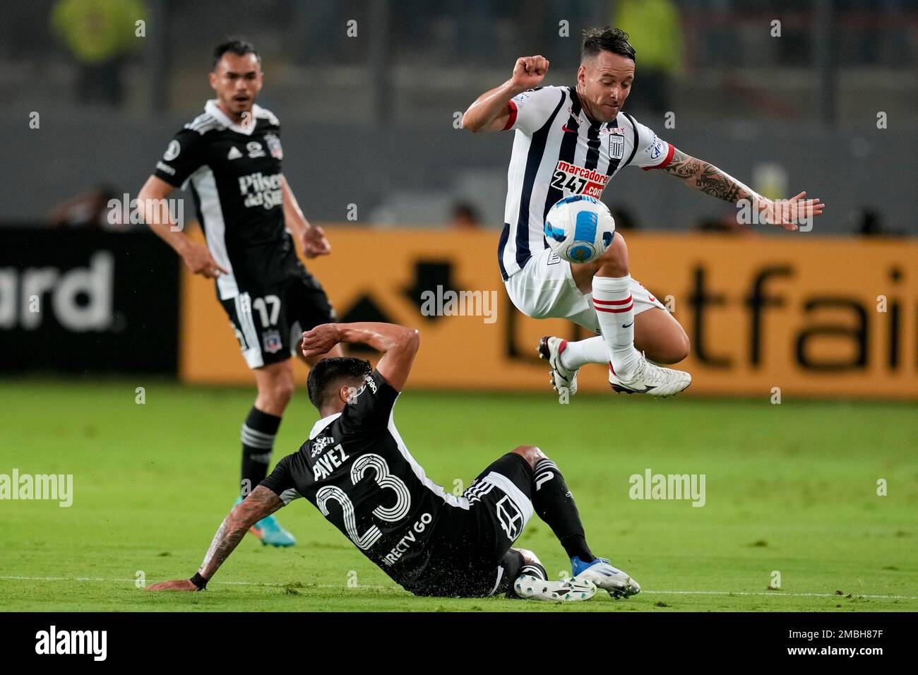 Pablo Lavandeira of Peru's Alianza Lima, right, and Esteban Pavez of ...
