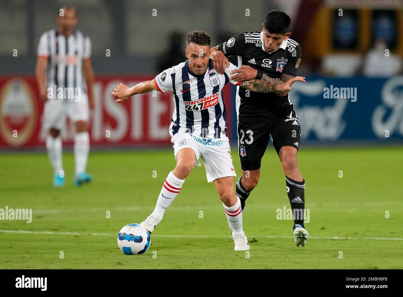 Pablo Lavandeira of Peru's Alianza Lima, left, and Esteban Pavez of ...