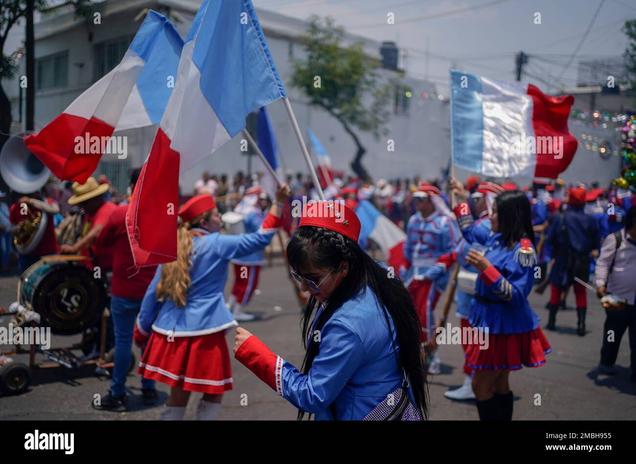 Women dance with French flags during a re-enactment of The Battle of ...