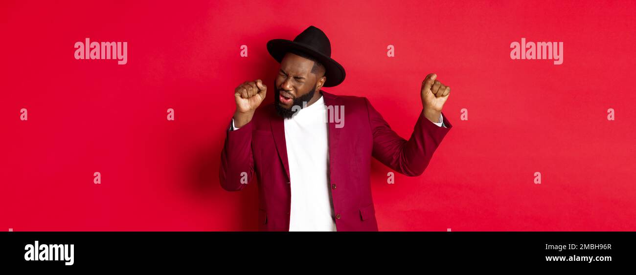 Christmas and people concept. Happy Black man celebrating New Year and ...