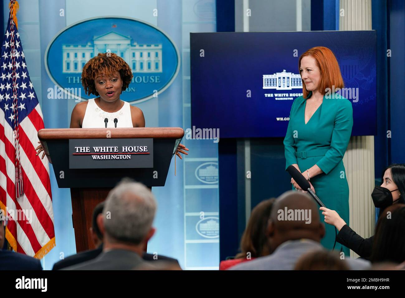White House press secretary Jen Psaki, right, listens as incoming press ...