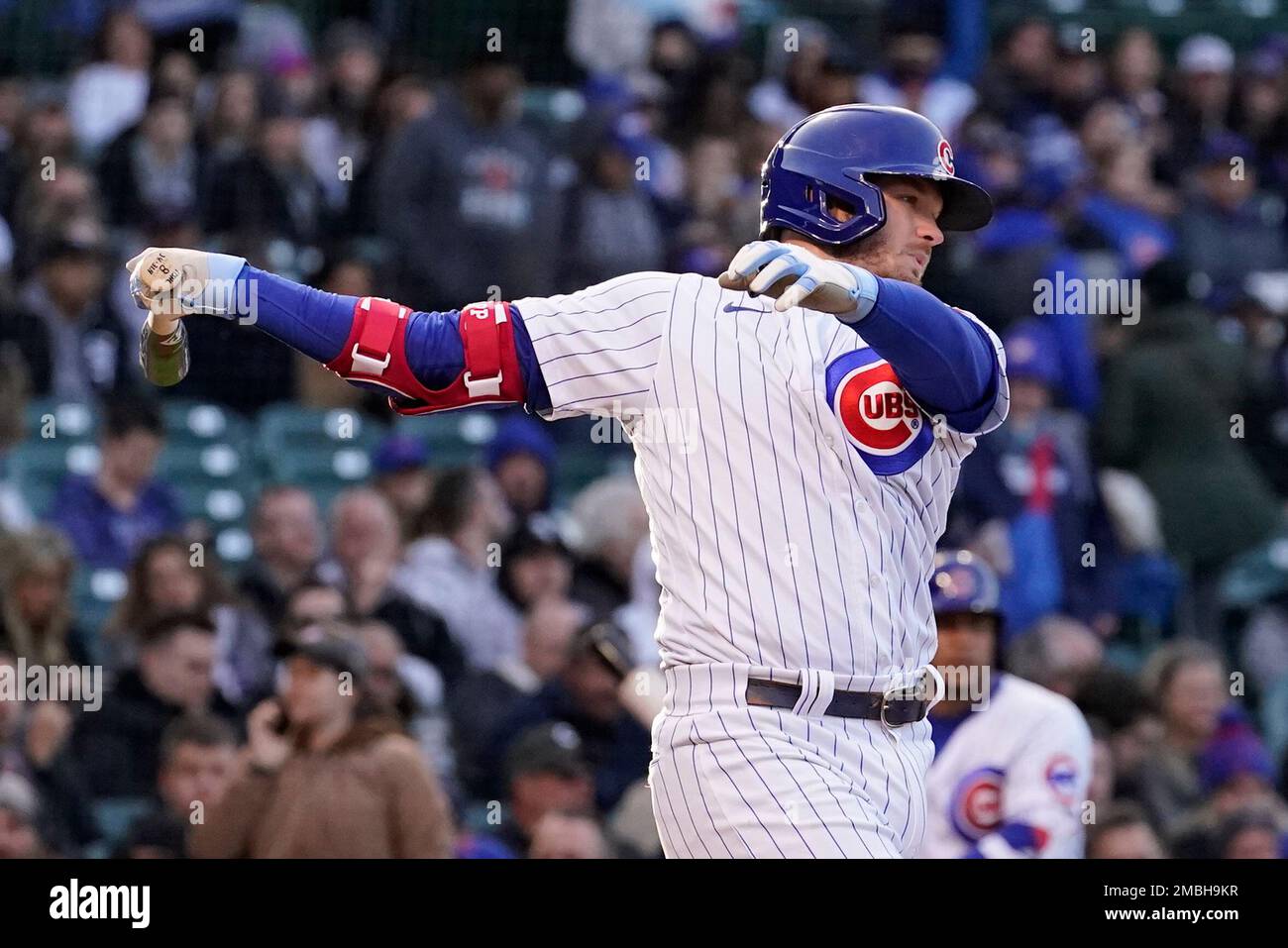 Chicago Cubs' Ian Happ swings at a pitch in a baseball game against the ...