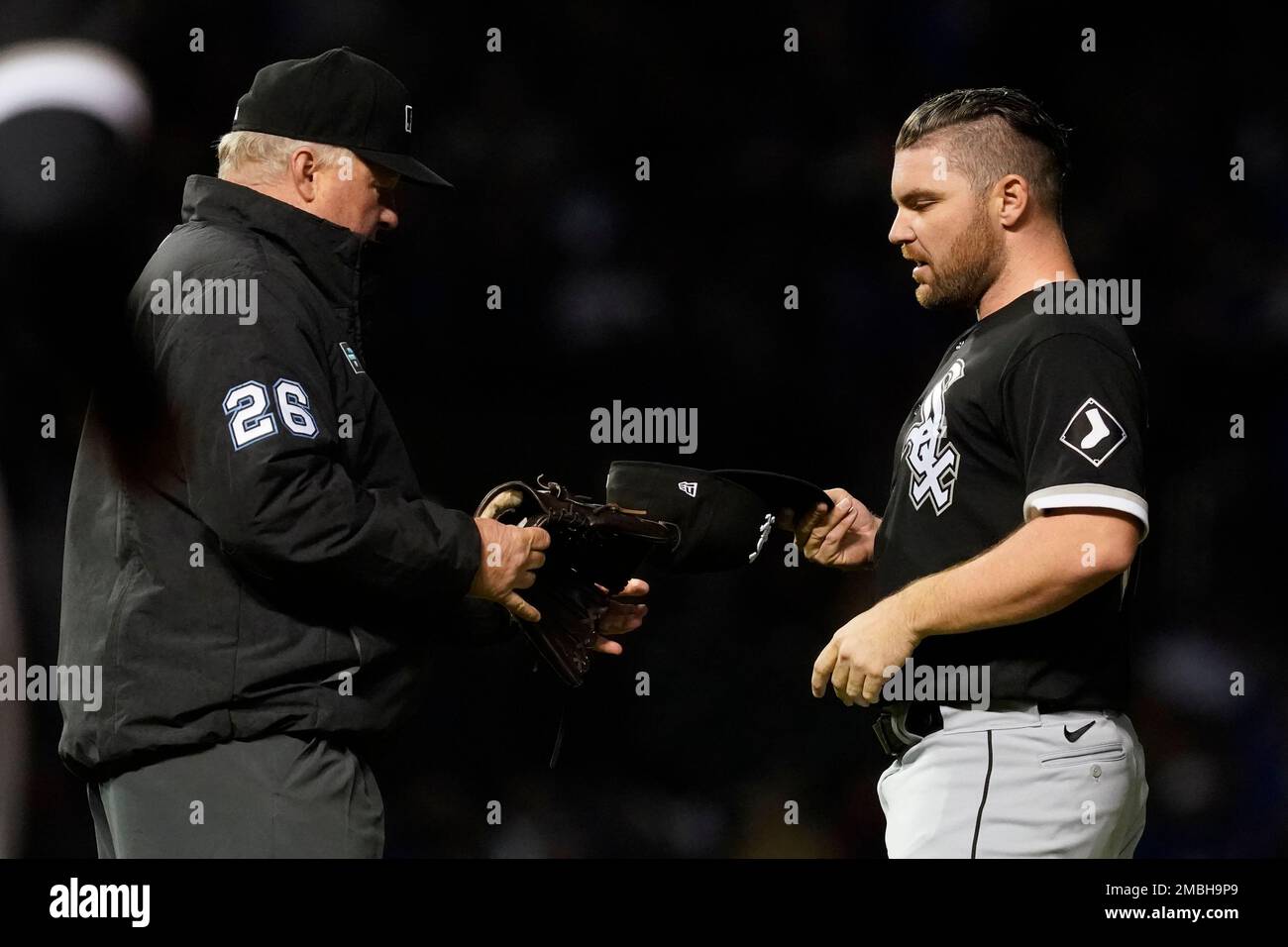 Umpire Bill Miller checks Chicago White Sox relief pitcher Liam ...