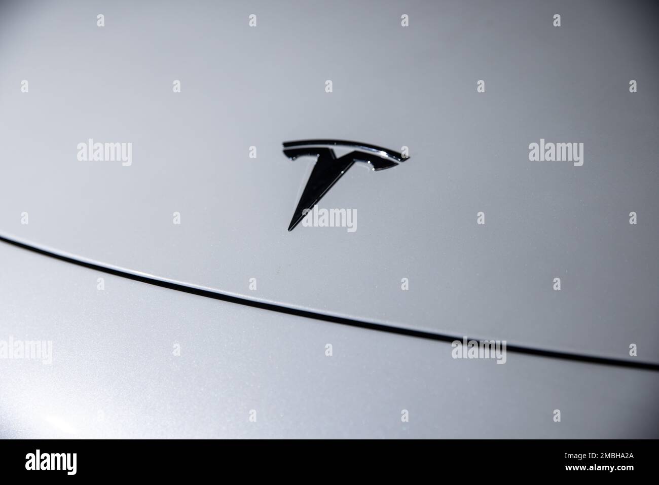 A Tesla sign is seen on a car in Melbourne, Friday, January 20, 2023 ...