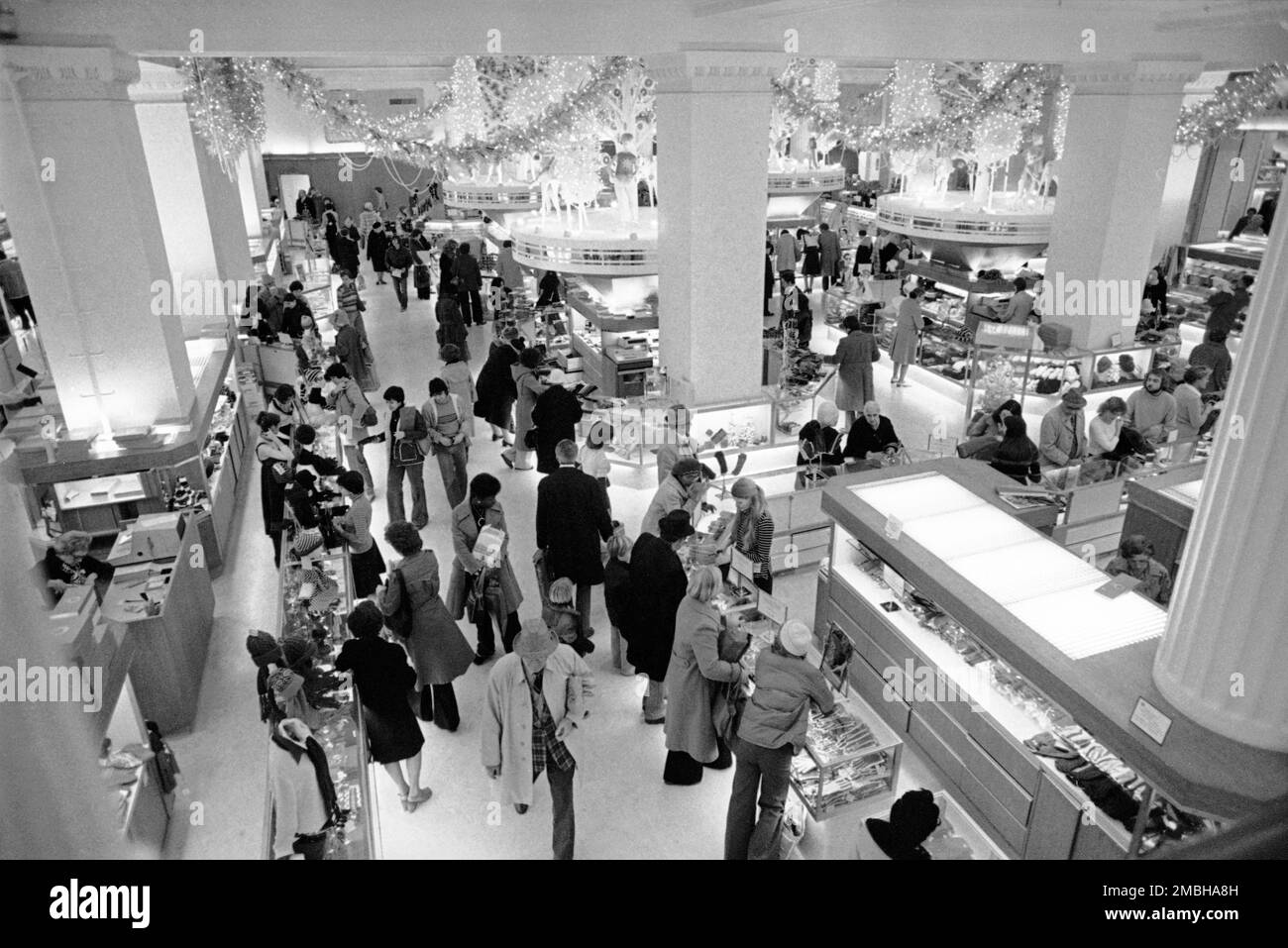 Christmas shoppers browse the first floor of Marshall Field & Co ...