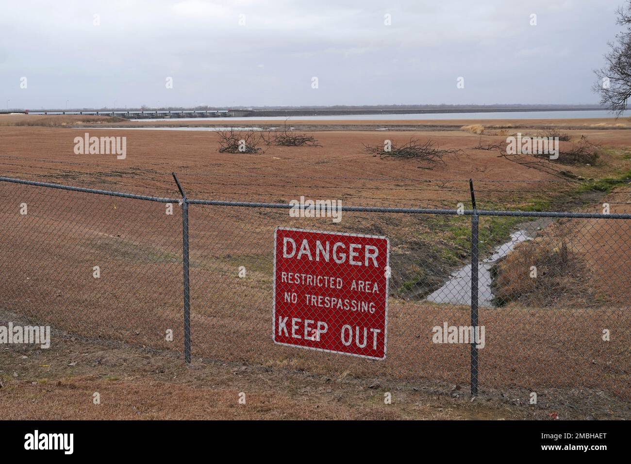 Fencing surrounds lake side of the Rockwall-Forney Dam in Forney, Texas ...