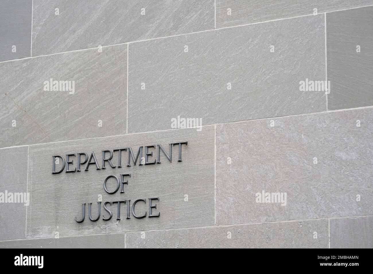 A sign marks the facade of the Robert F. Kennedy Department of Justice ...