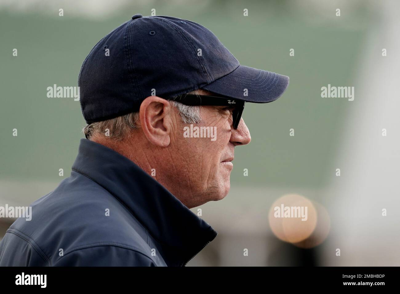 Horse trainer Tim Yakteen looks out from his barn after a workout at ...
