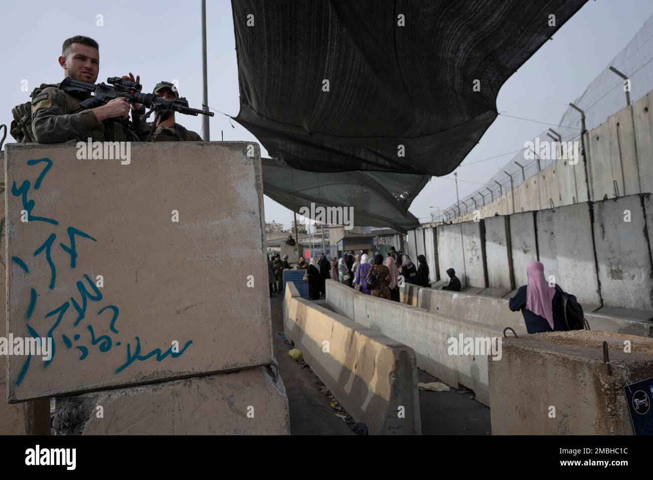 FILE - Israeli Border Police officers secure a checkpoint used by ...