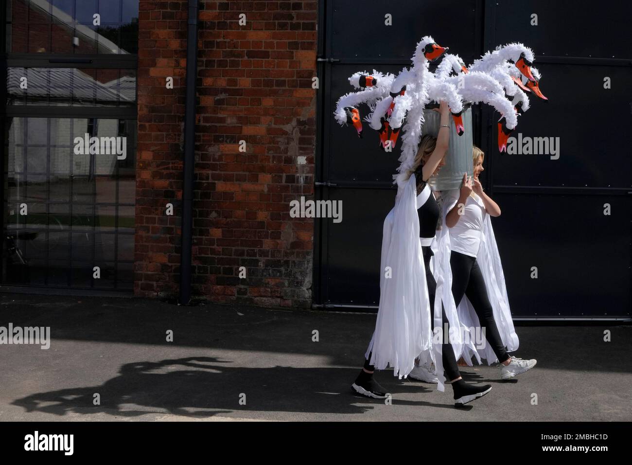 In swan outfits Courteney Gaskin and Katie Jones carry swan costumes ...