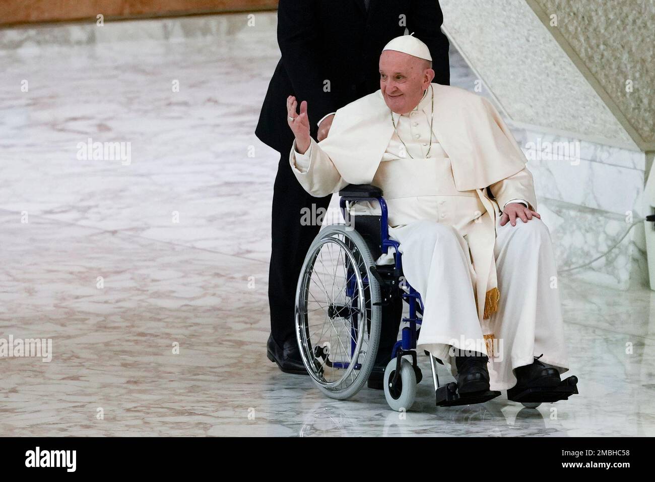 Pope Francis arrives in a wheelchair to attend an audience with nuns ...