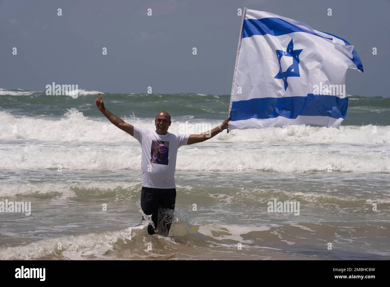 A man wears a shirt depicting former Israeli Prime Minister Benjamin ...