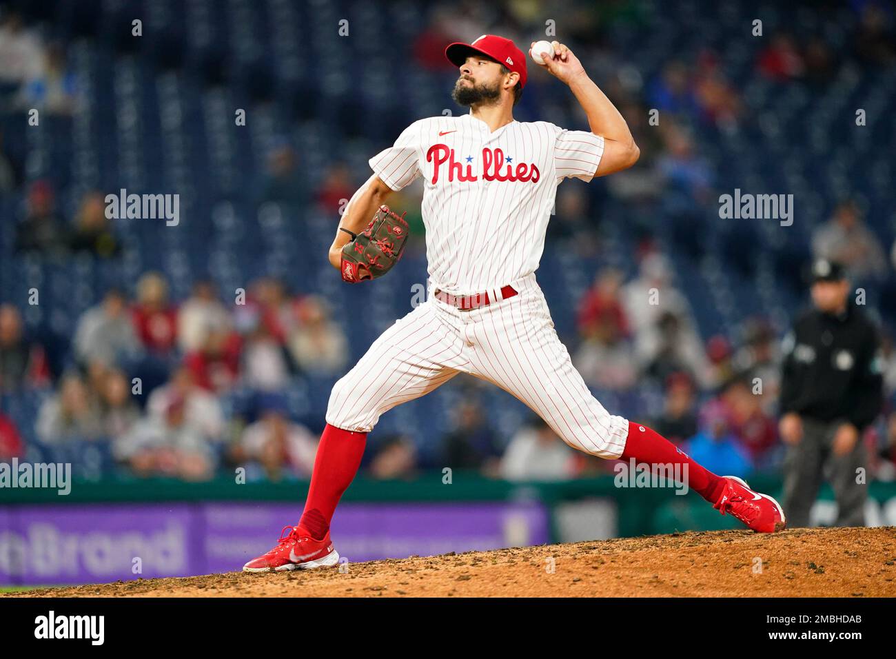 Philadelphia Phillies' Brad Hand pitches during the 10th inning of a ...