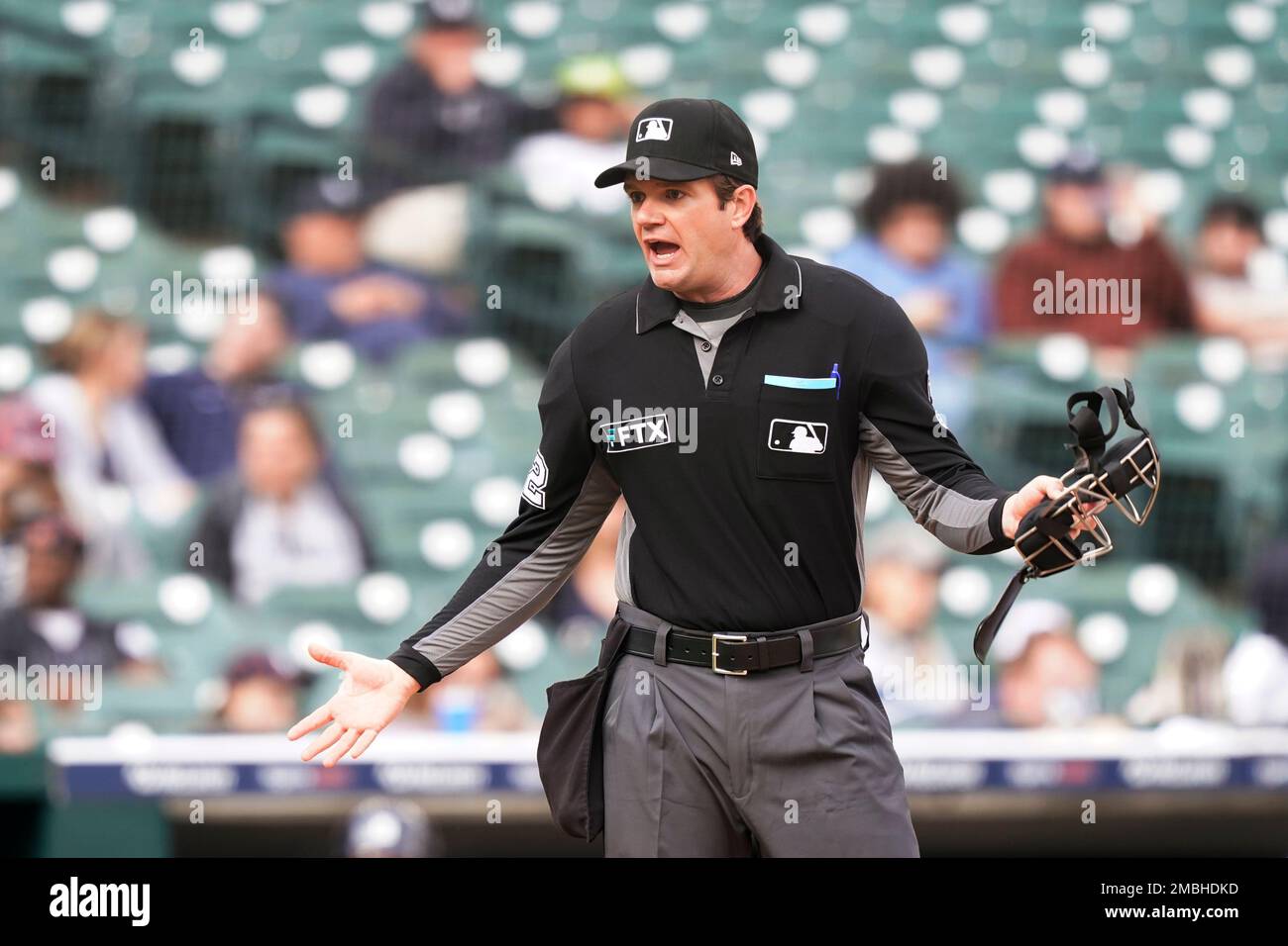 Home plate umpire Adam Beck yells towards the Pittsburgh Pirates dugout ...