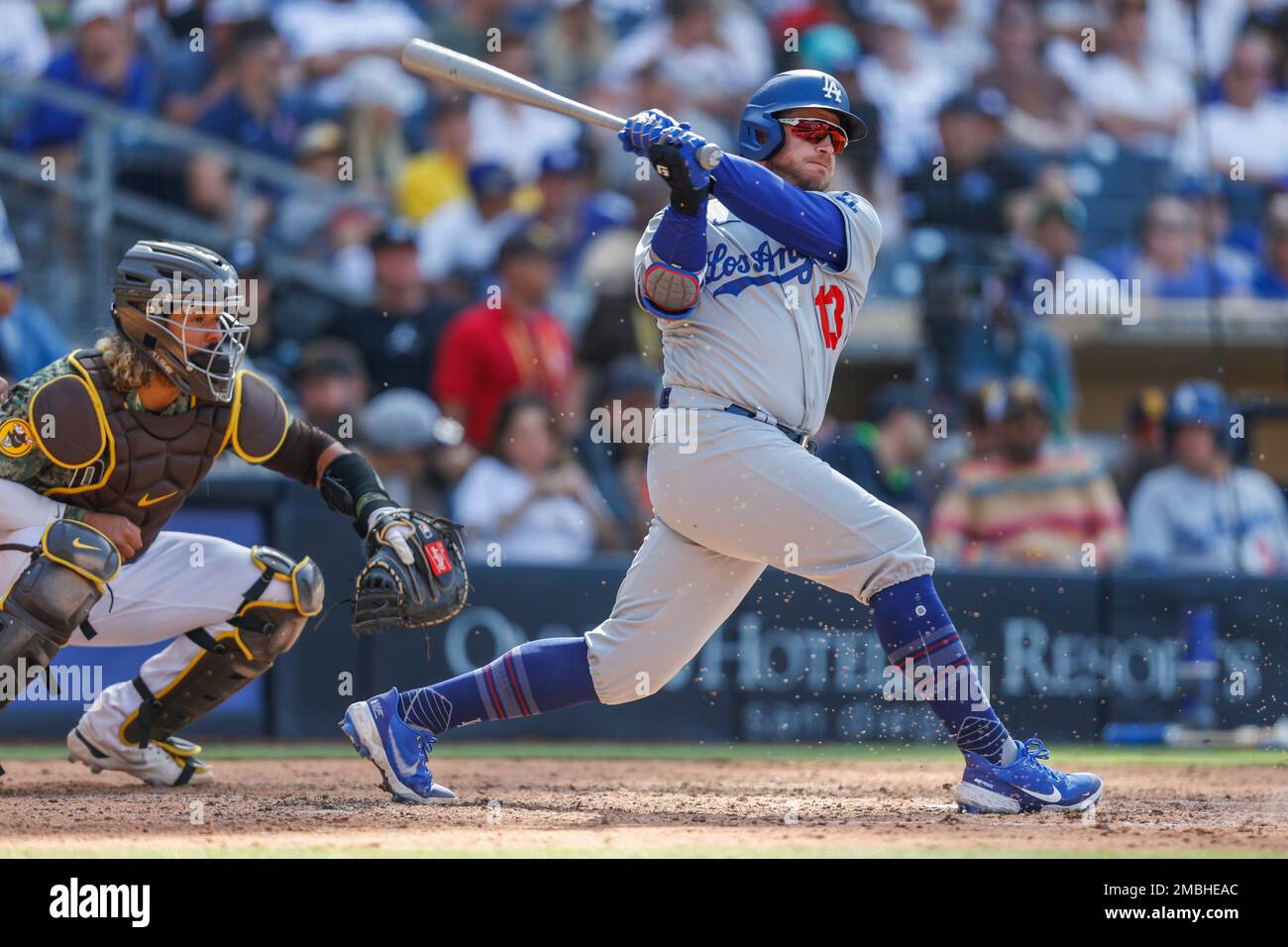 Los Angeles Dodgers Max Muncy makes contact at the plate against San ...