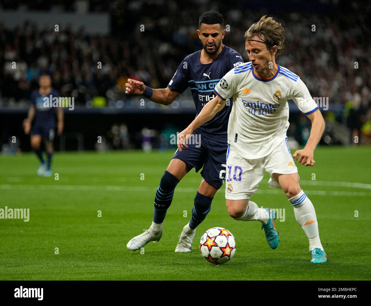 Real Madrid's Luka Modric, right, duels for the ball with Manchester ...