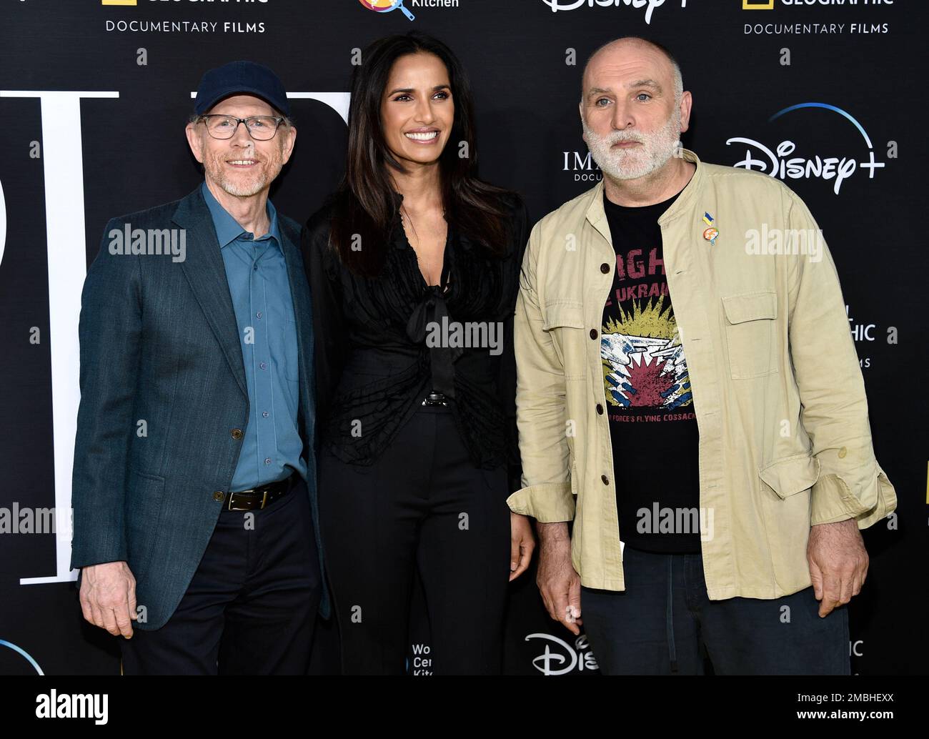 Ron Howard, left, Padma Lakshmi and Jose Andres attend the premiere of "We Feed People" at the ...