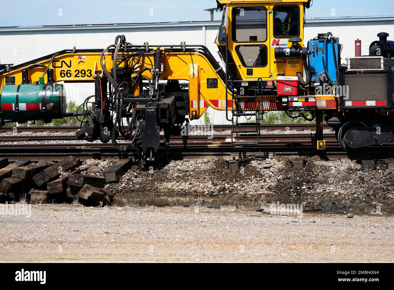 A Canadian National Railway tie exchanger places new wooden ties under ...