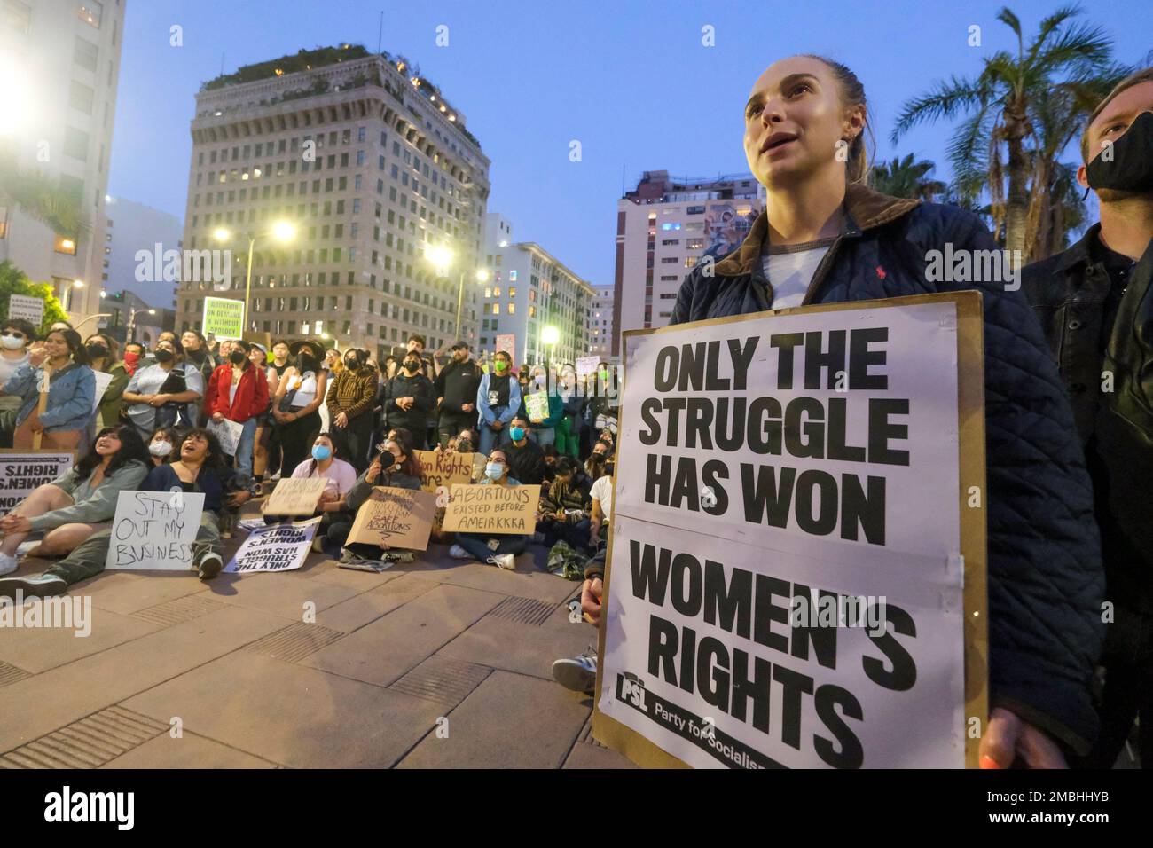 Ashley Greyson, 31, holds a sign as demonstrators gather at Pershing ...