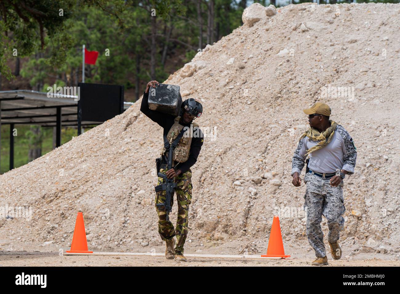 A Jamaican Defence Force Soldier carries an 80-pound block during the ...