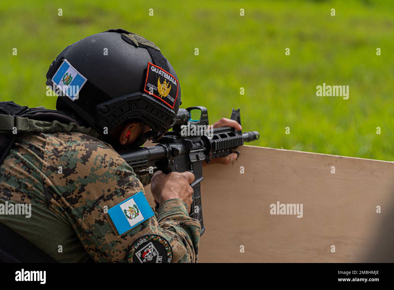 LA VENTA, Honduras - A member of the Guatemalan Armed Forces shoots as ...