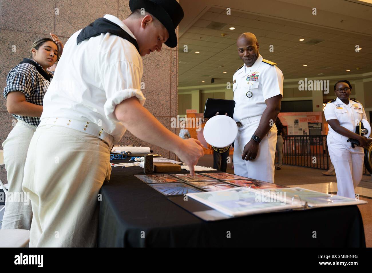 Rear Adm. Lex Walker, Commander, Navy Recruiting Command, talks with ...