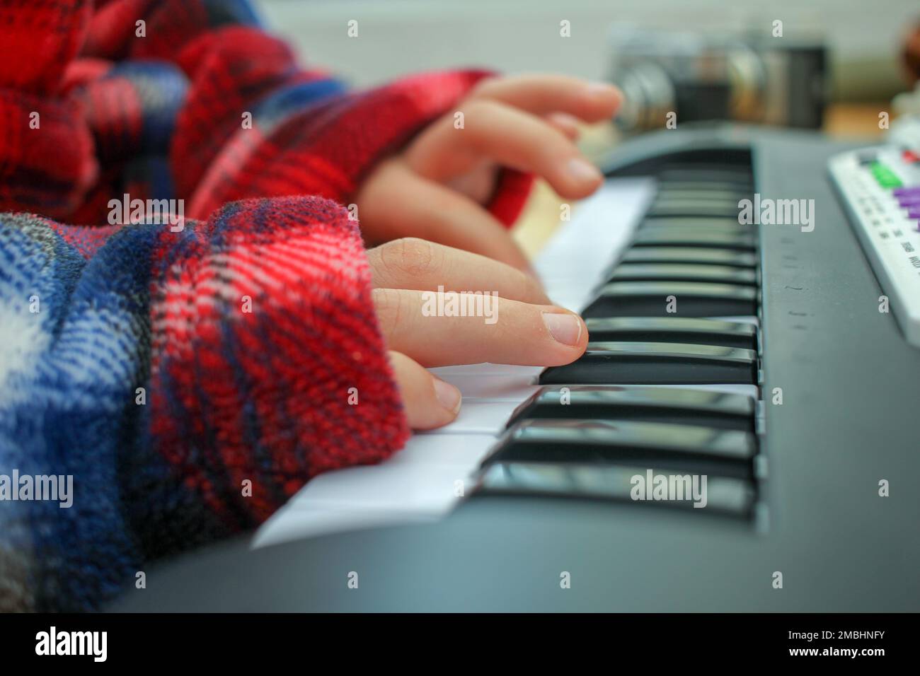 boy playing toy piano for fun at home Stock Photo - Alamy