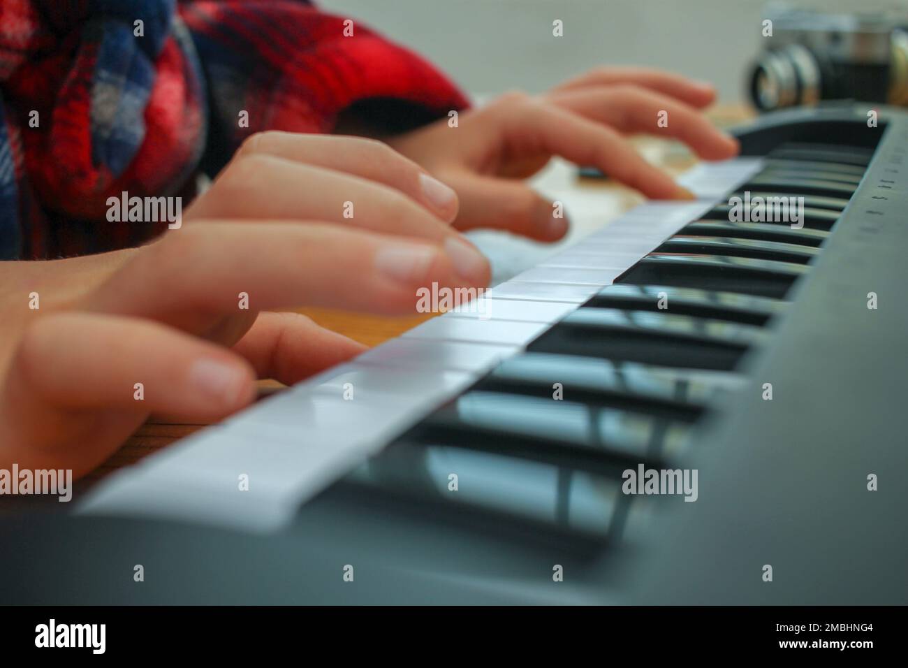 Child fingers playing instrument hi-res stock photography and images ...