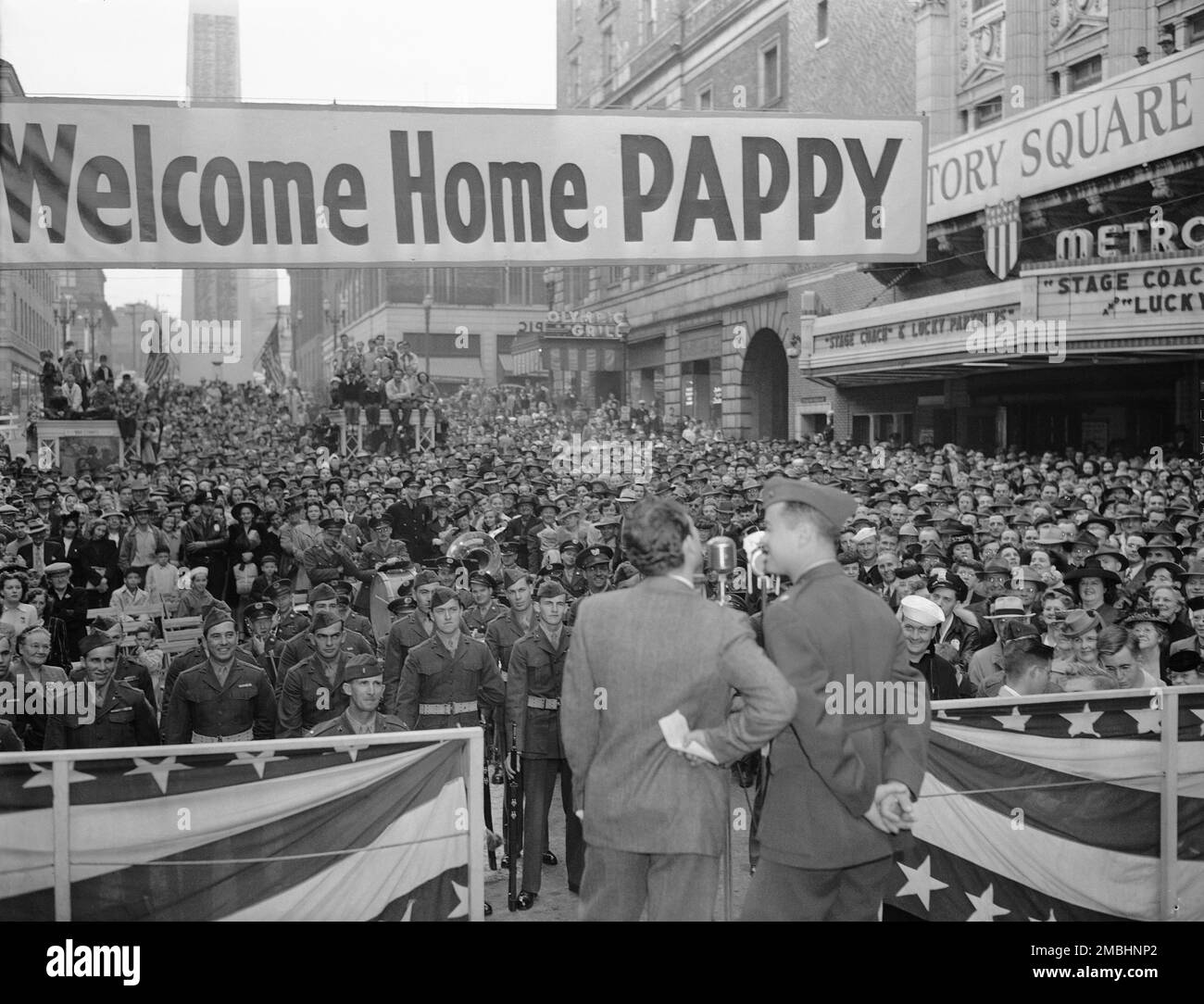 A very large and cheering crowd and a big "Welcome Home" sign greeted ...