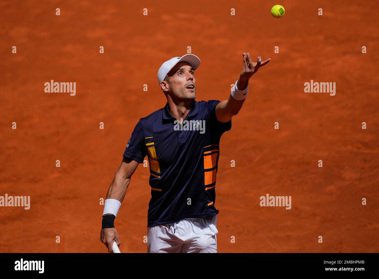 Spain's Roberto Bautista serves during a match against Jenson Brooksby ...
