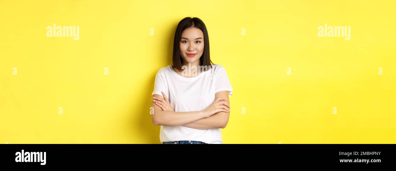 Confident and stylish asian woman cross arms on chest and smiling ...