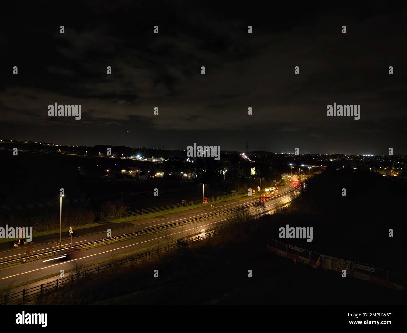 An aerial shot of an urban road at night with yellow lighting Stock ...