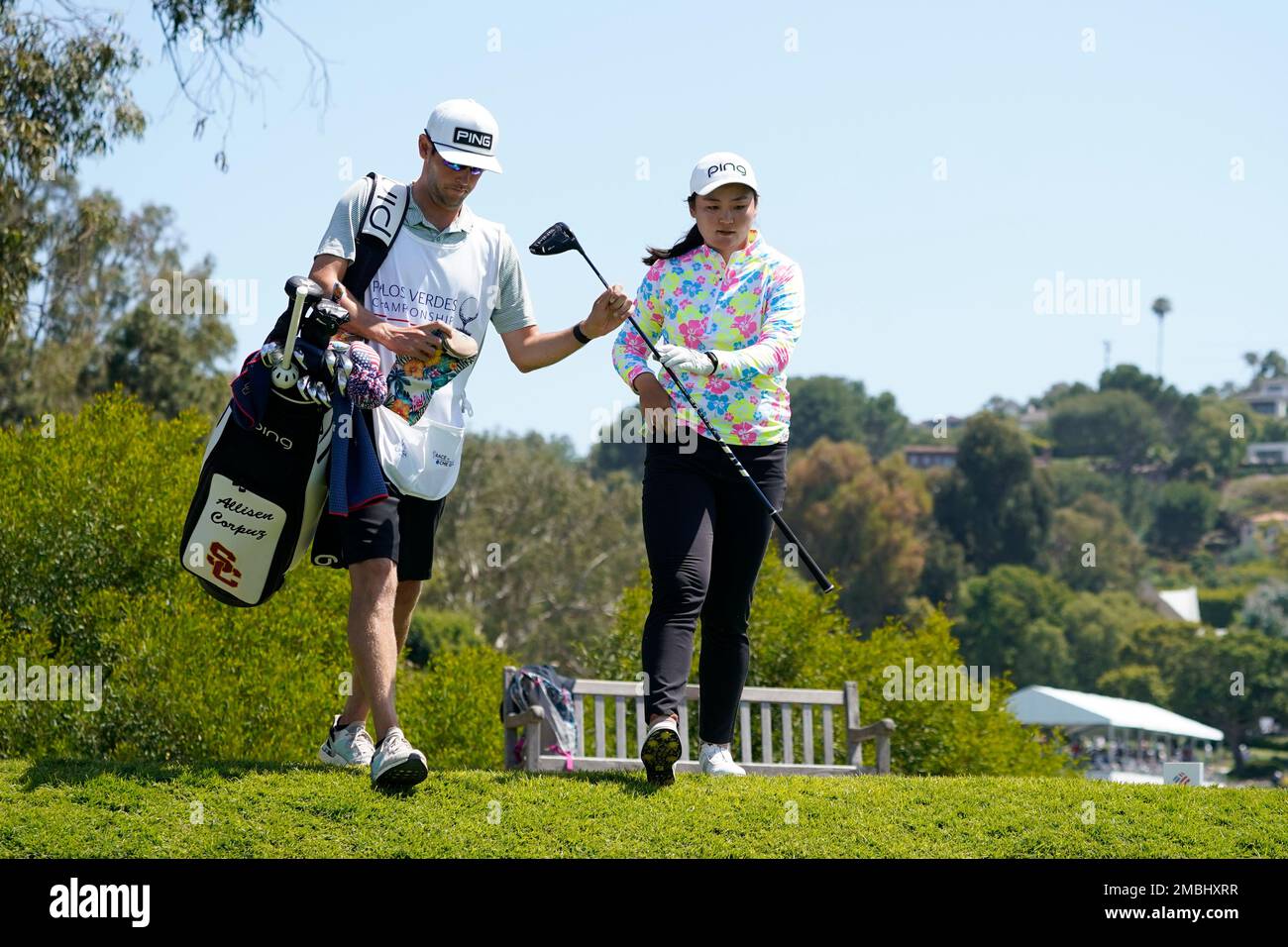 Allisen Corpuz and her caddie, Jay Monahan, walk away from the fourth tee during the final round ...