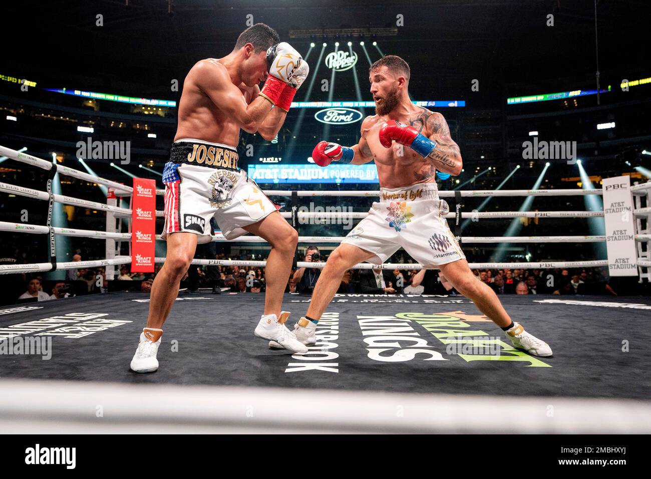 Cody Crowley, right, from Canada, trades punches with Josetito Lopez ...