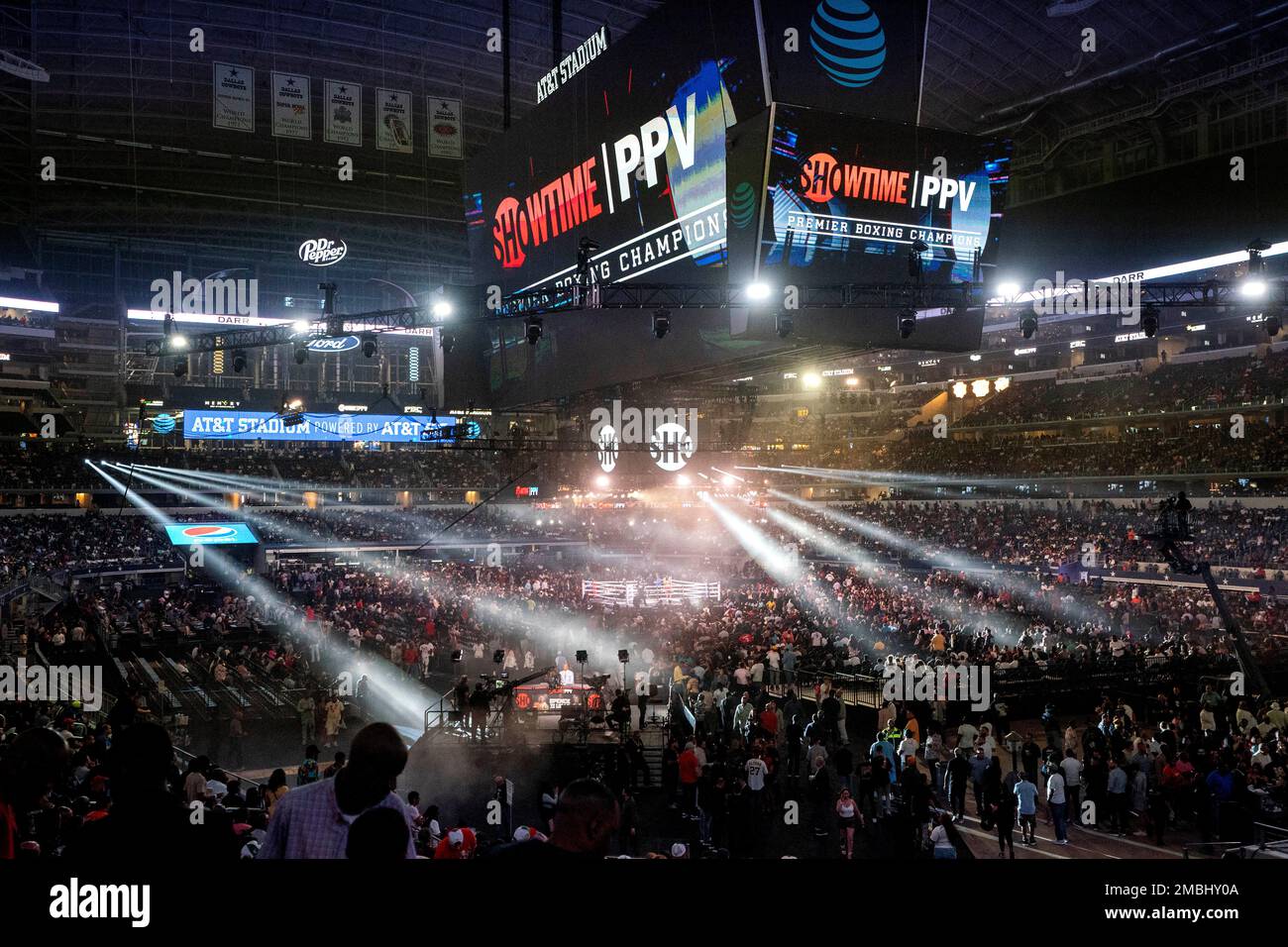 Fans watch an undercard boxing match between Jose Valenzuela, from ...